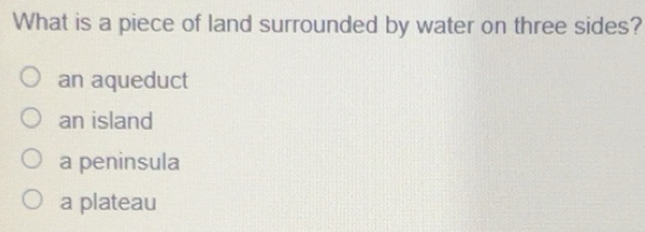Solved: What is a piece of land surrounded by water on three sides? an ...