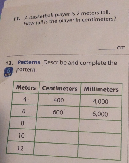 Solved: A basketball player is 2 meters tall. How tall is the player in ...
