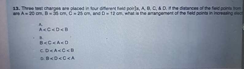 Solved: Three test charges are placed in four different field poirs, A ...