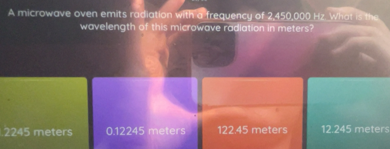 Resuelto:A microwave oven emits radiation with a frequency of 2,450,000 ...