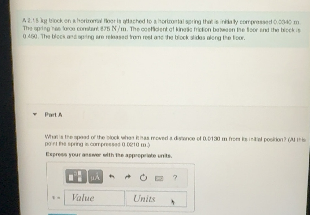 Solved: A 2.15 kg block on a horizontal floor is attached to a ...