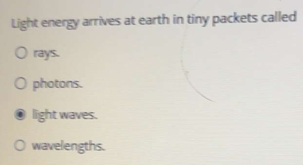 Solved: Light energy arrives at earth in tiny packets called rays ...